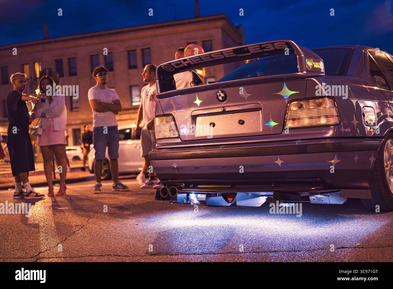 Rome, italy 5 august 2025: spectators admiring a customized bmw e36 ...
