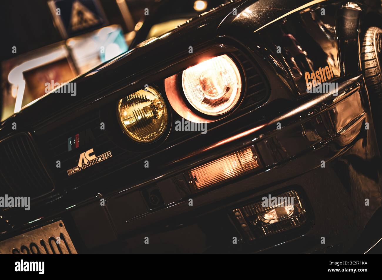 Rome, italy 5 august 2025: front part of a tuned black bmw e30 with its ...