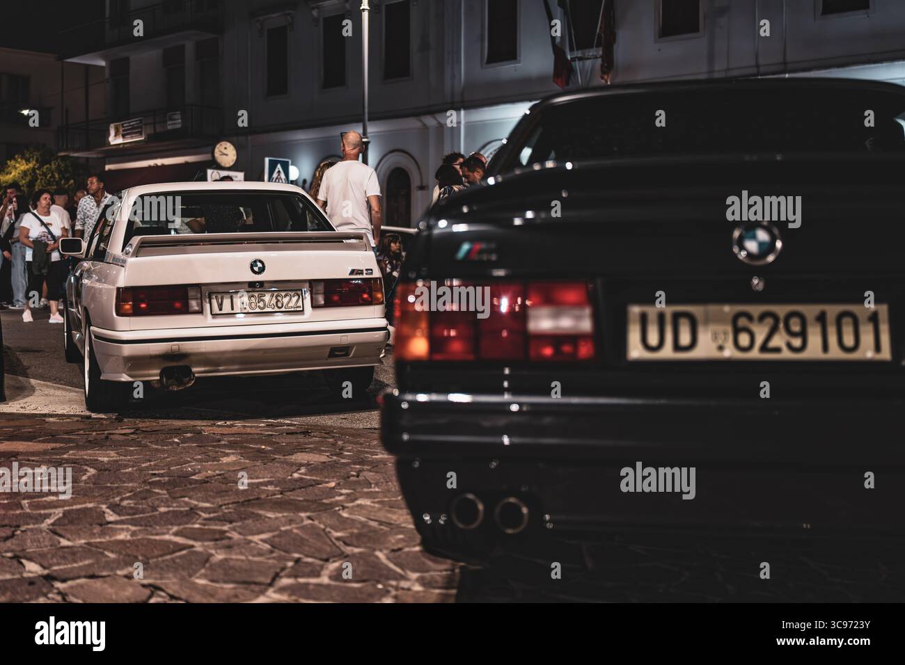Rome, italy 5 august 2025: white and black tuned bmw m3 e30 cars parked ...