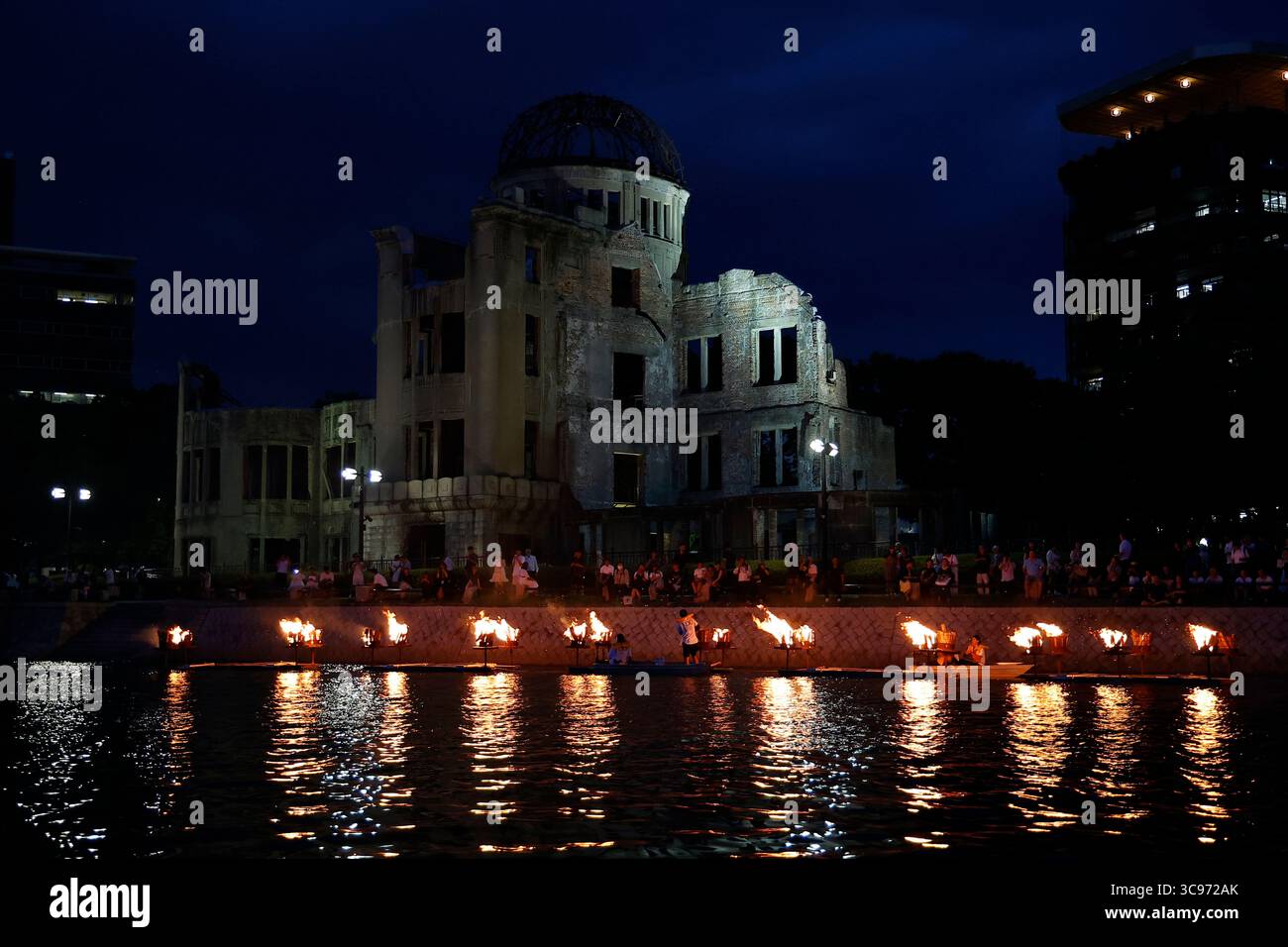 August 5, 2025, Hiroshima, Japan: Torches are lit and placed on the ...