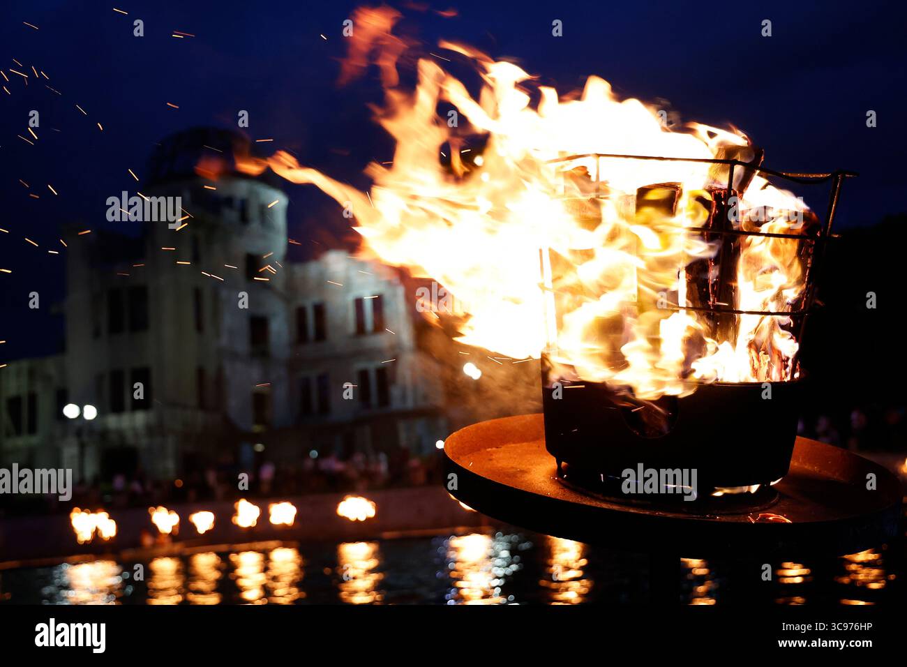 August 5, 2025, Hiroshima, Japan: Torches are lit and placed on the ...