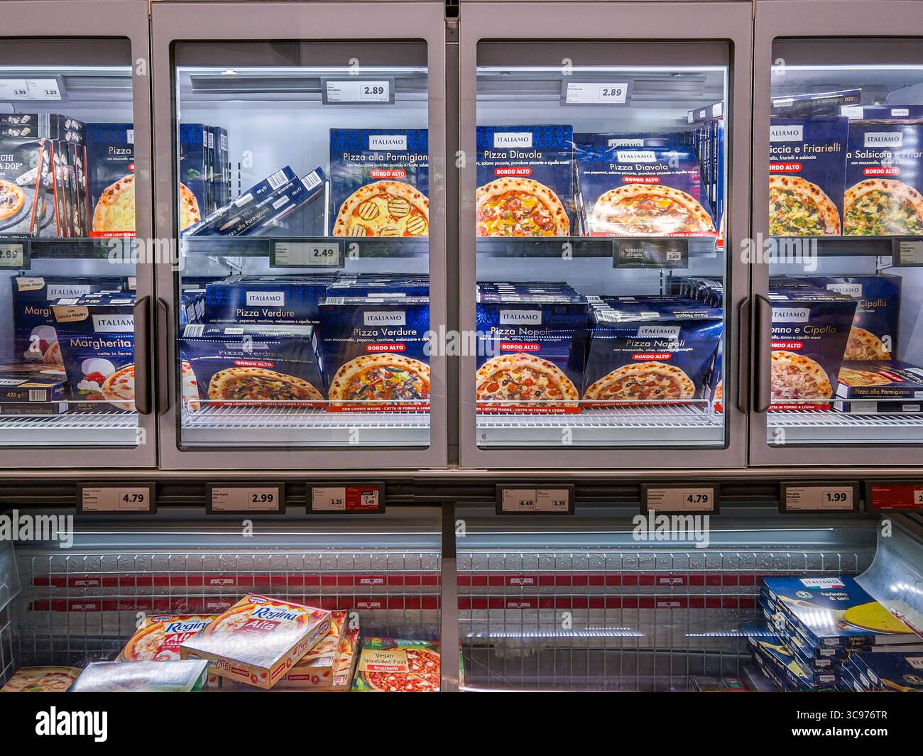 Italy - August 4, 2025: Traditional Italian pre-cooked frozen pizzas in ...