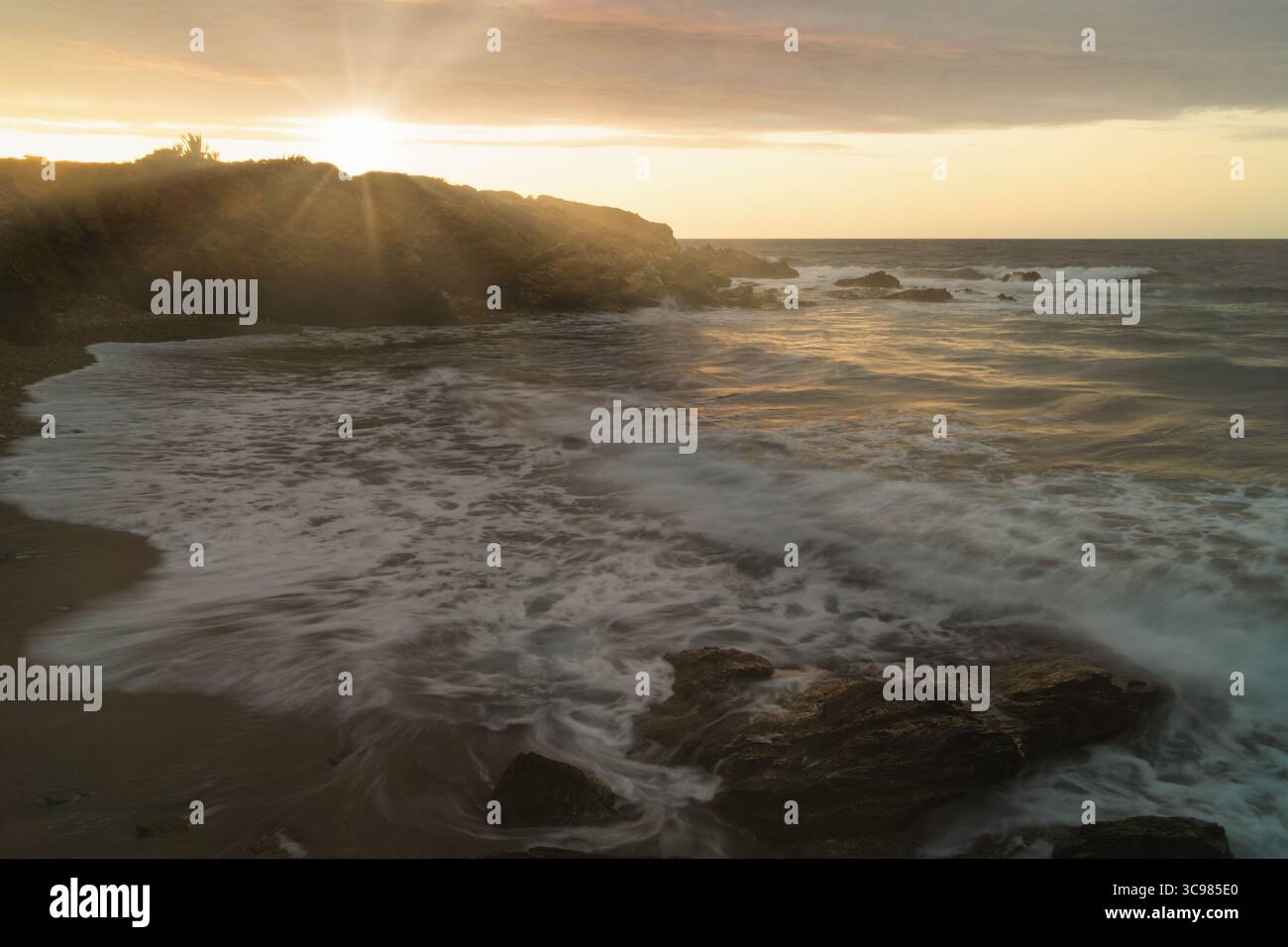 Storm waves roll onto rocky hi-res stock photography and images - Alamy