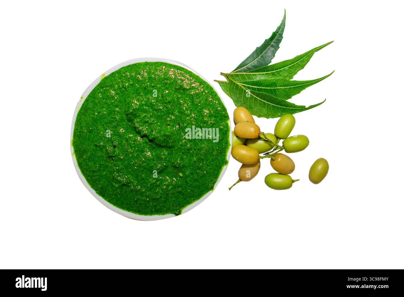 Medicinal neem leaves with ground paste over white background. Herbal ...