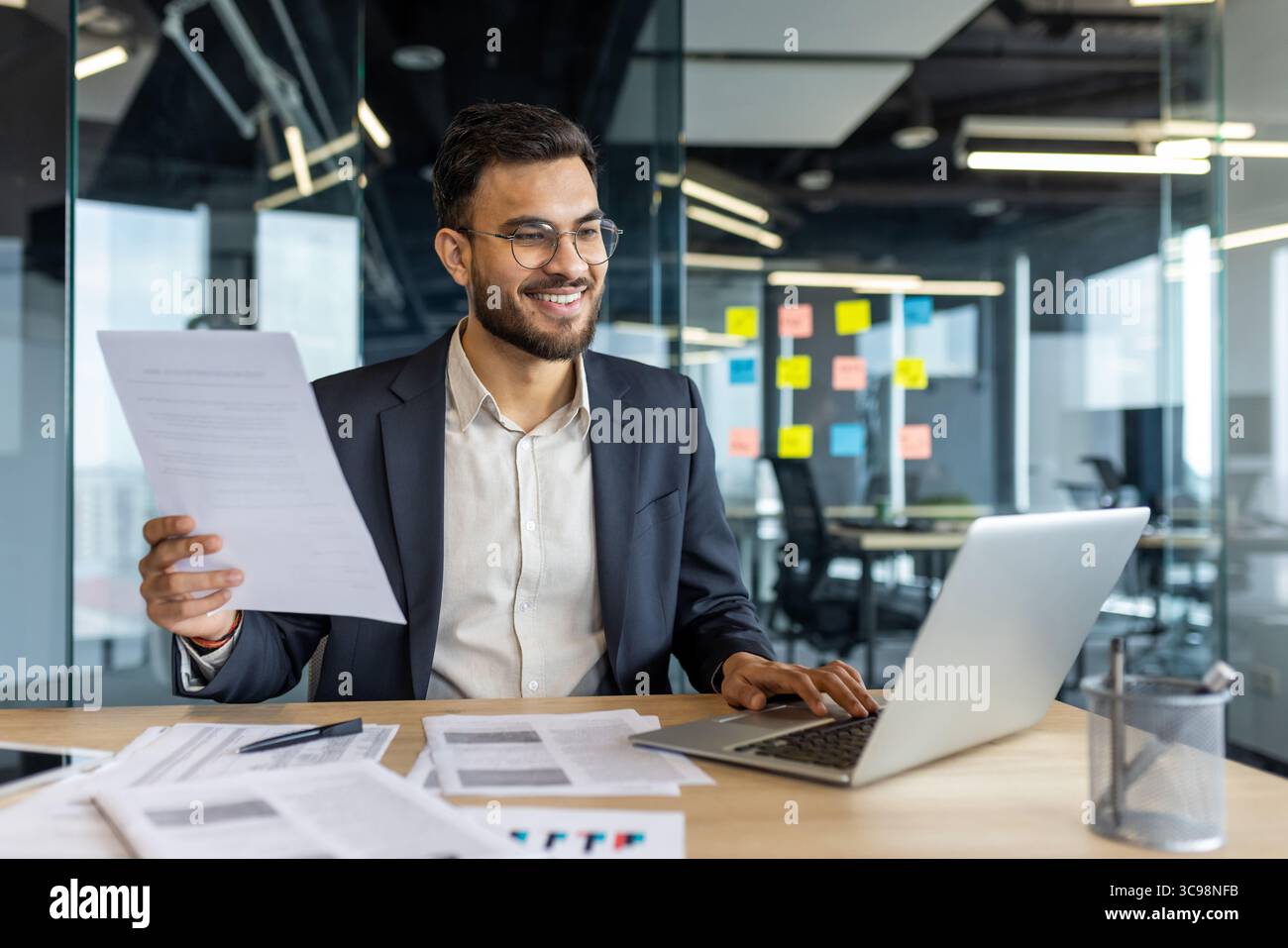Business manager reviews paper contract hi-res stock photography and ...