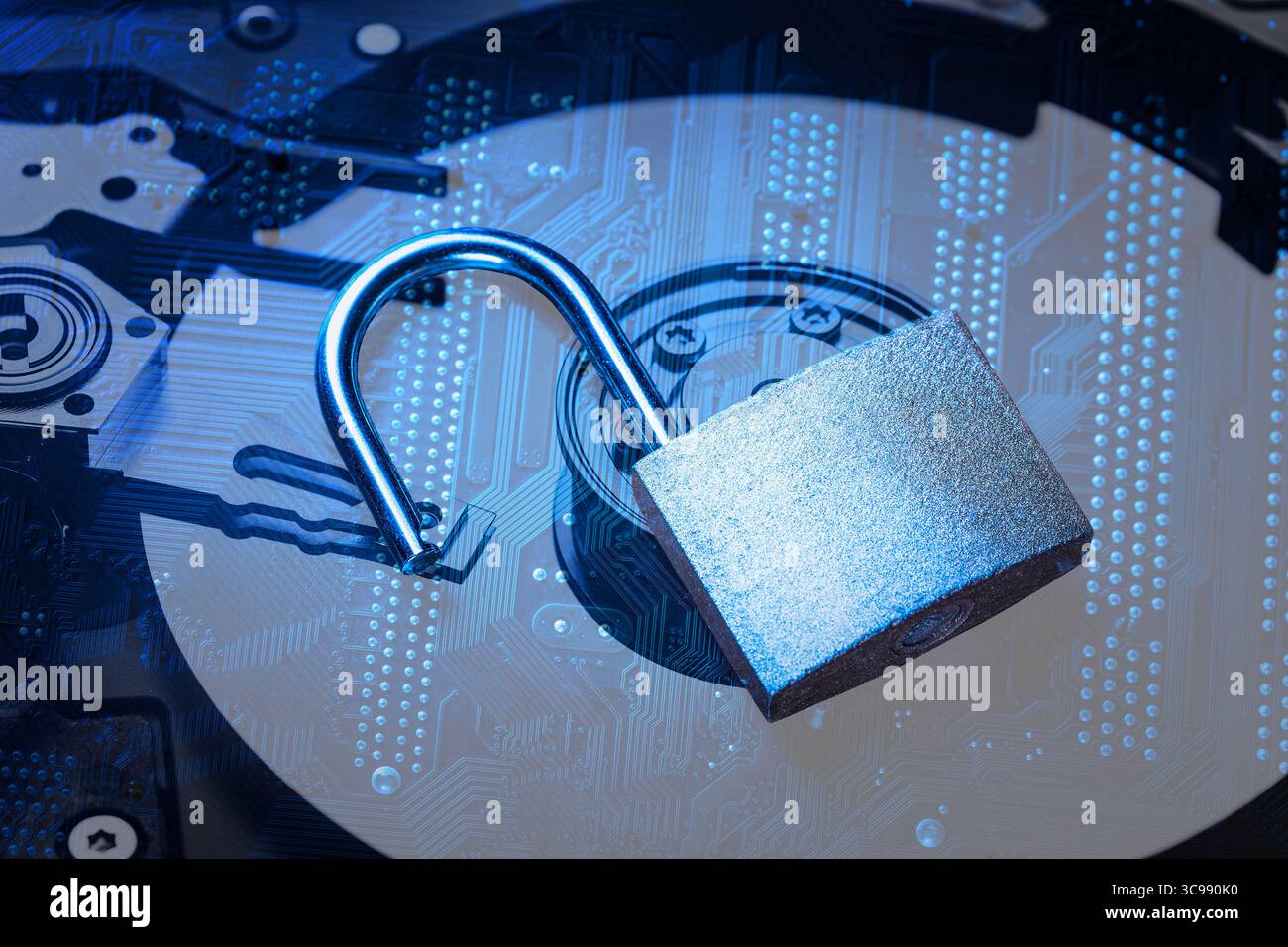 Opened padlock on computer motherboard and hard disk drive. Internet ...