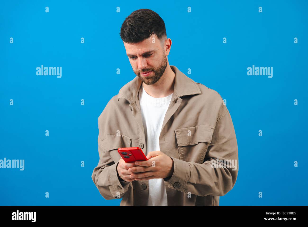 Young man wearing blue jacket hi-res stock photography and images - Alamy