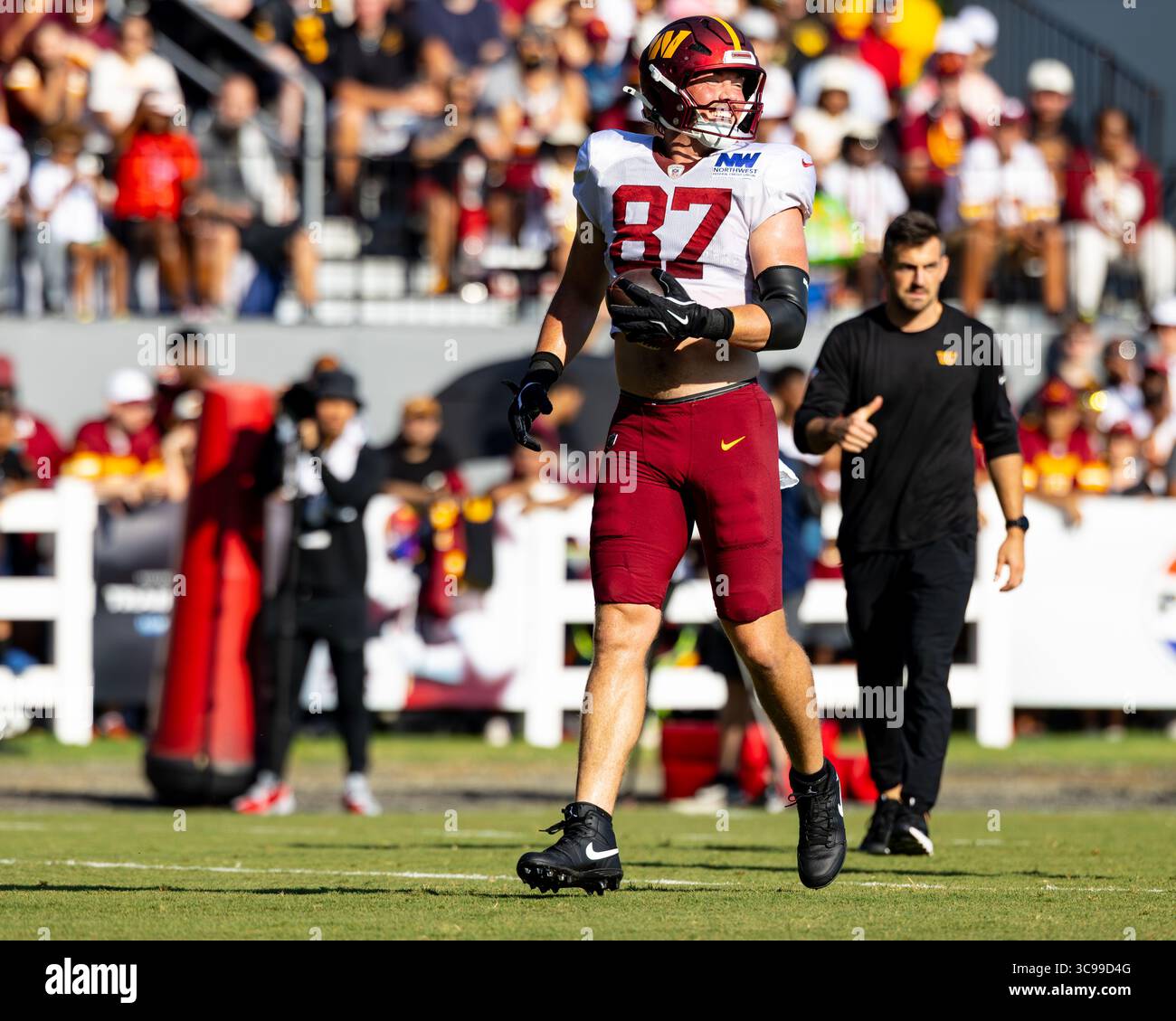 Ashburn,VA. USA; Washington Commanders tight end John Bates (87) runs ...