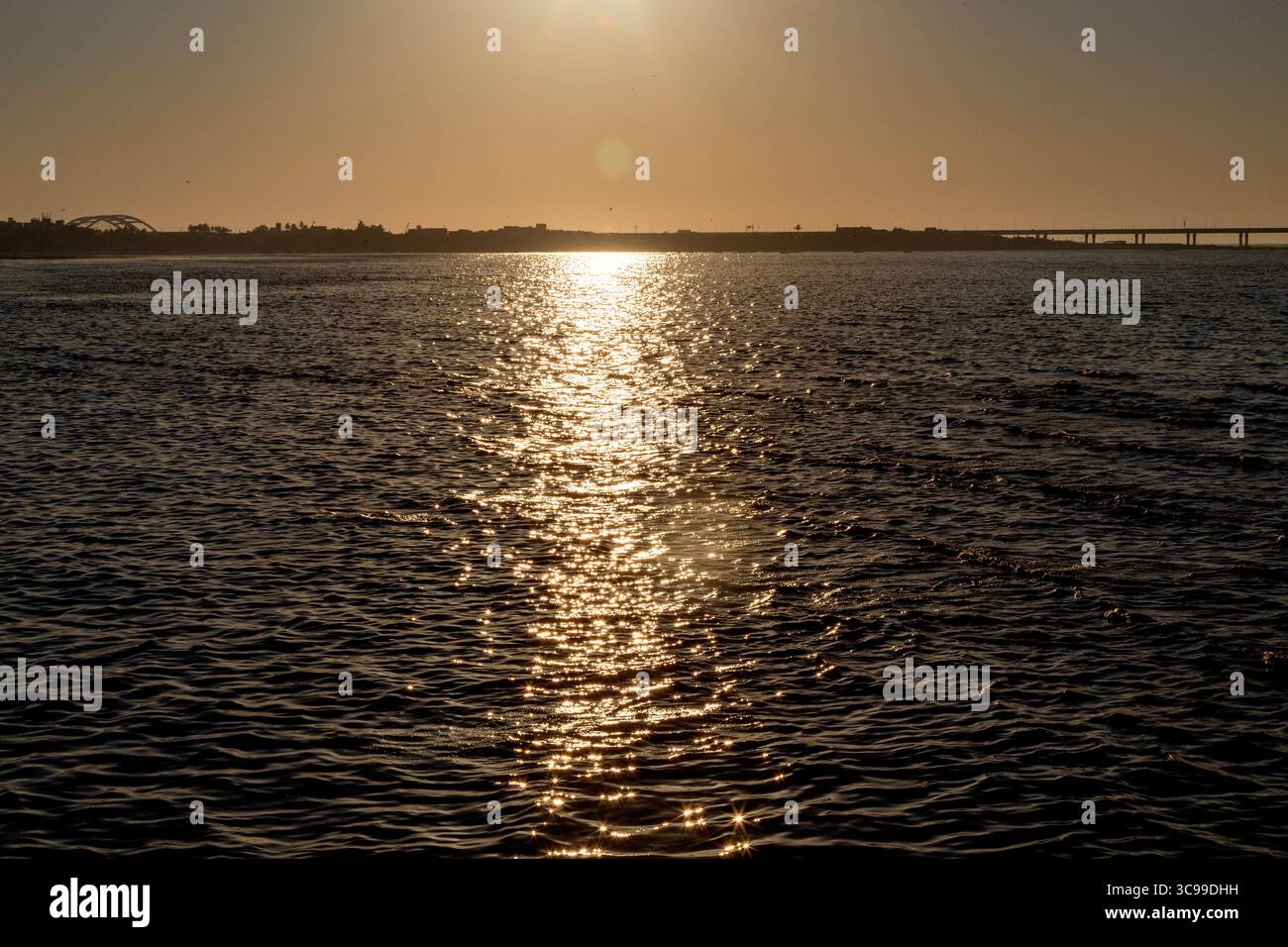 Calm ocean waves reflecting sunset hi-res stock photography and images ...