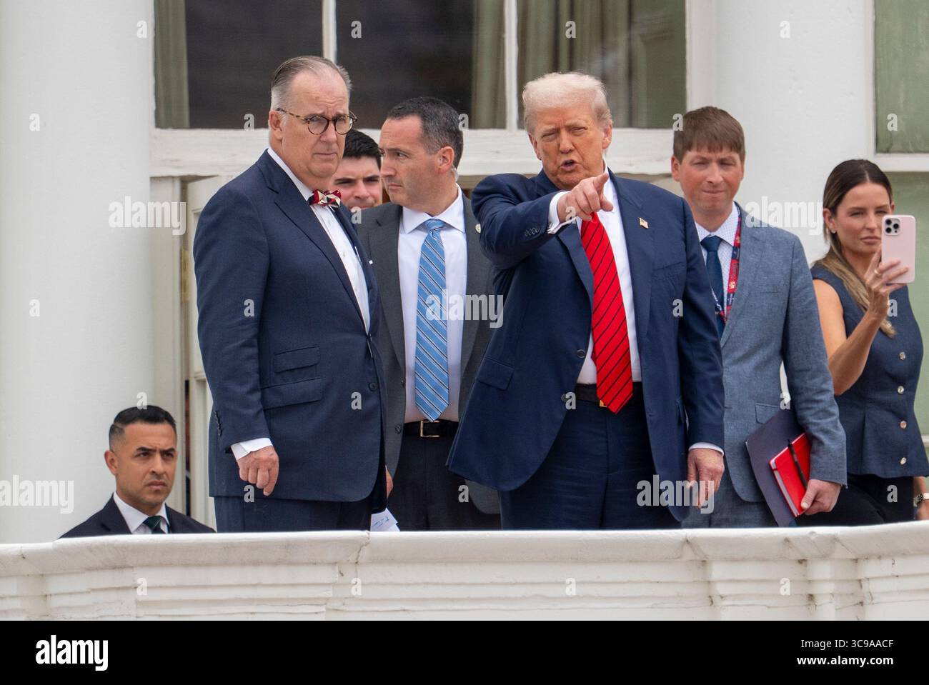 President Donald Trump, center, with architect James McCrery, left ...