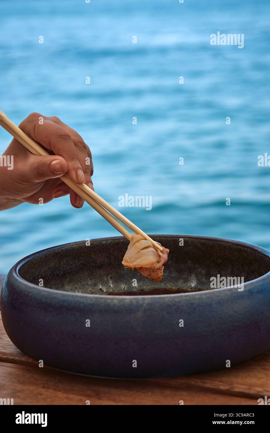 Hand skillfully using chopsticks hi-res stock photography and images ...