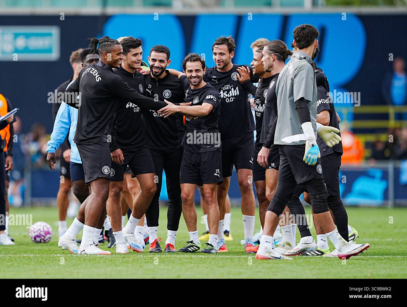Manchester City huddle during training session at the City Football ...
