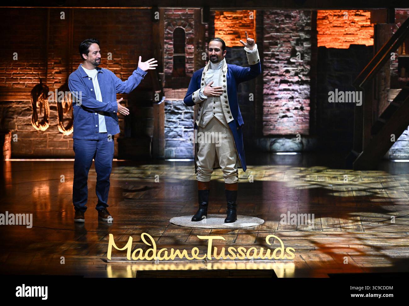 Lin-Manuel Miranda, left, participates in a Madame Tussauds "Hamilton ...