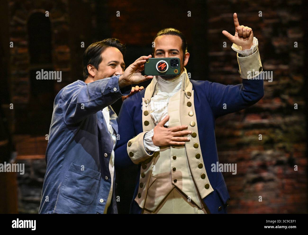 Lin-Manuel Miranda, left, participates in a Madame Tussauds "Hamilton ...