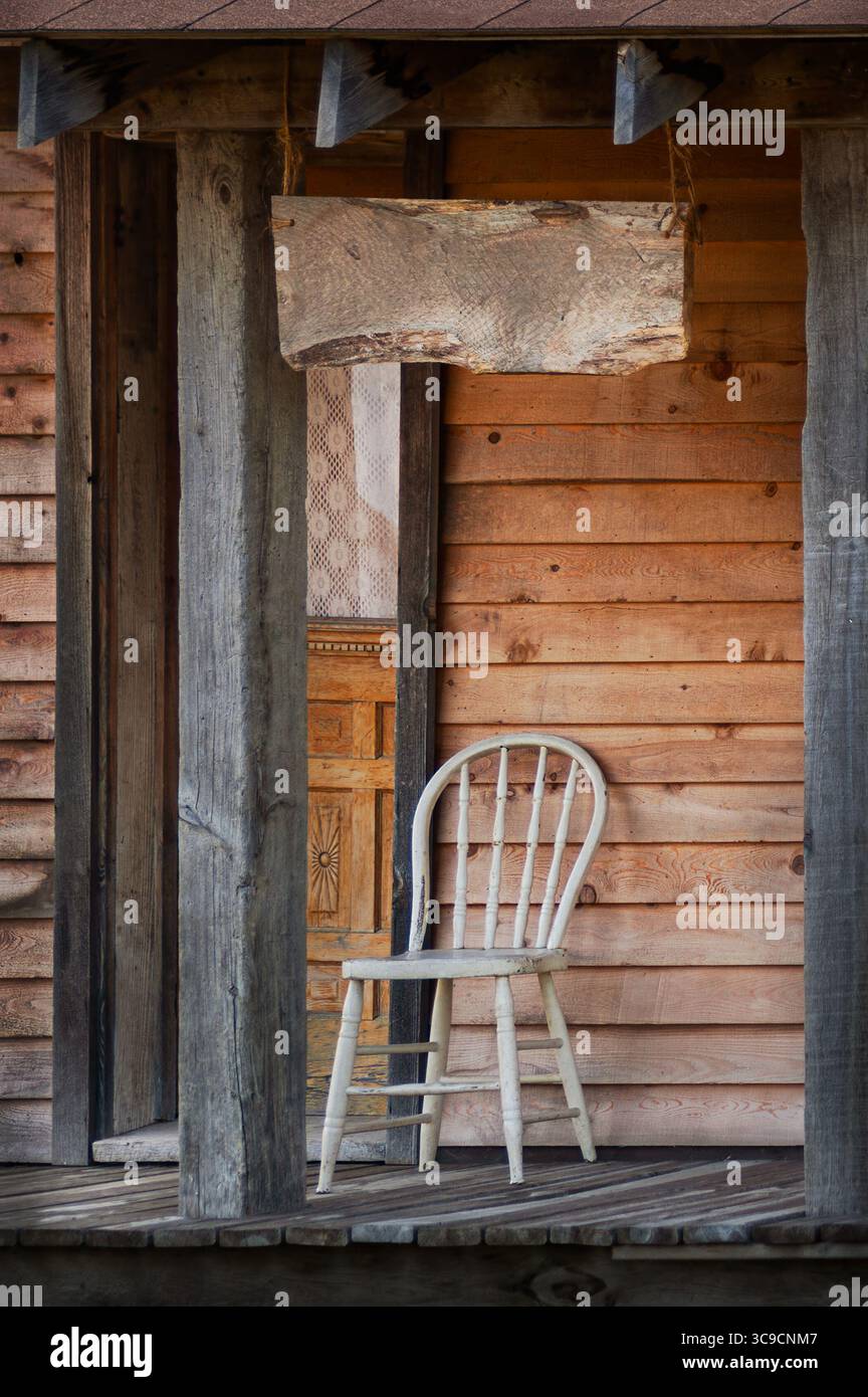 Chair Sits on Porch Under Hanging Wood Plant Sign - weathered Stock ...