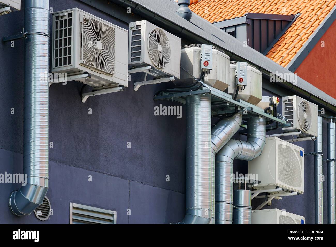 A detailed view of HVAC air conditioning units and large ventilation ...