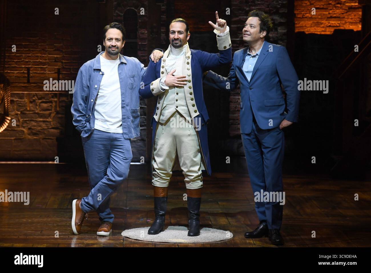 Lin-Manuel Miranda (l) and emcee Jimmy Fallon (r) pose with Madame ...