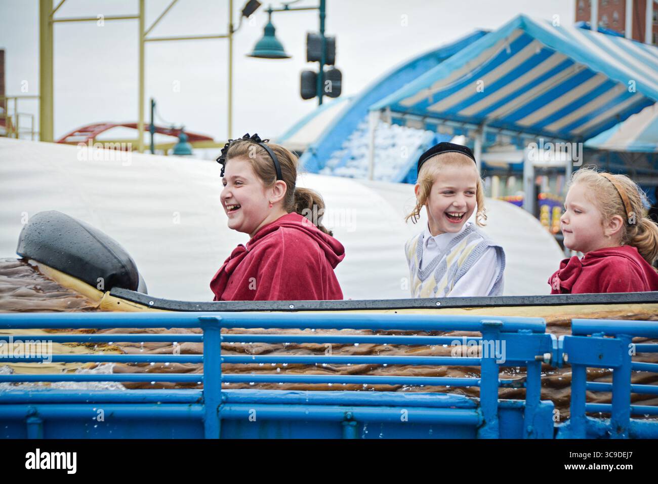 Religious Jewish children on the Wild River ride at Luna Park in Coney ...