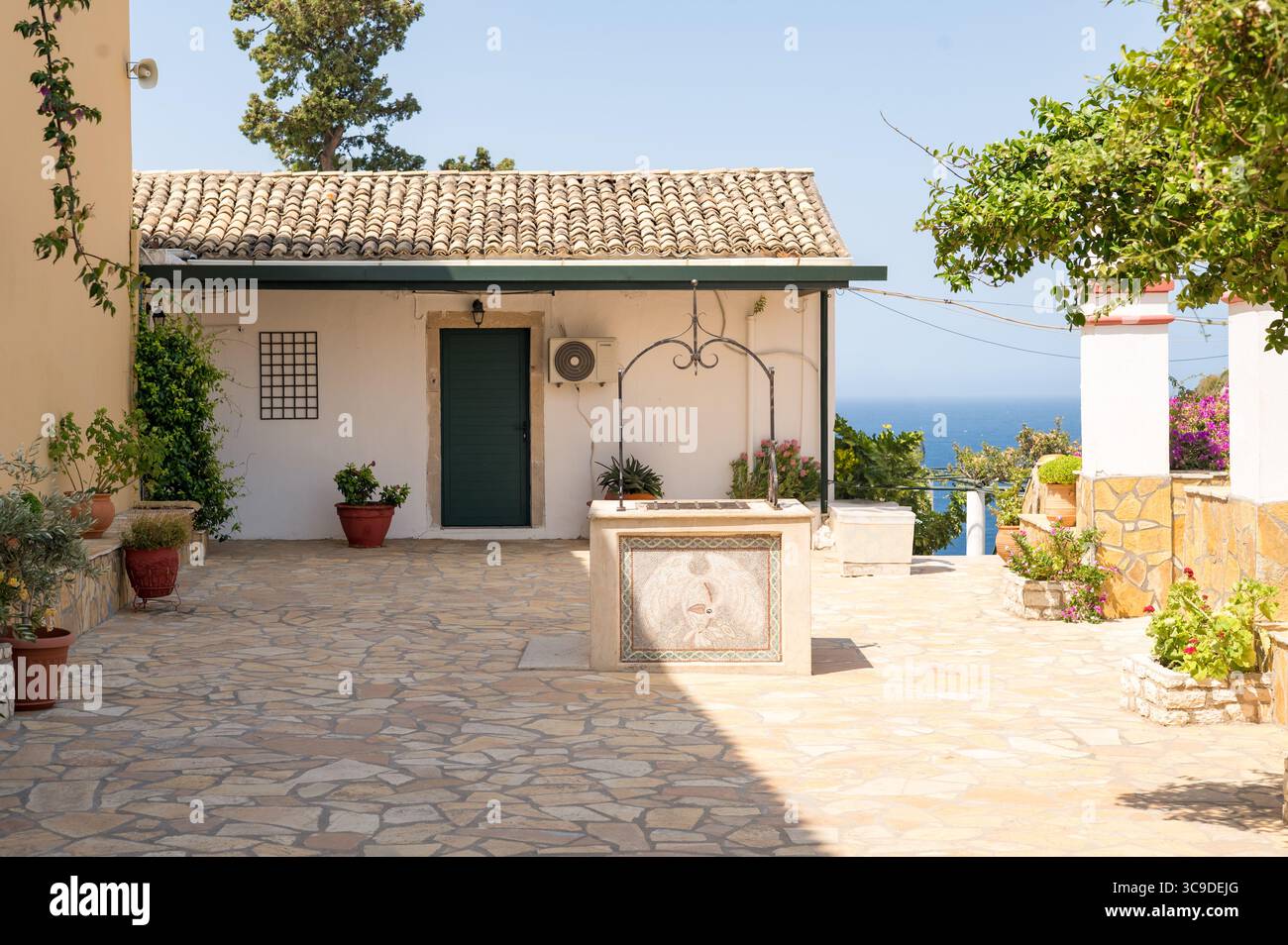 Traditional Greek Courtyard with Mosaic Well and Sea View in Corfu ...