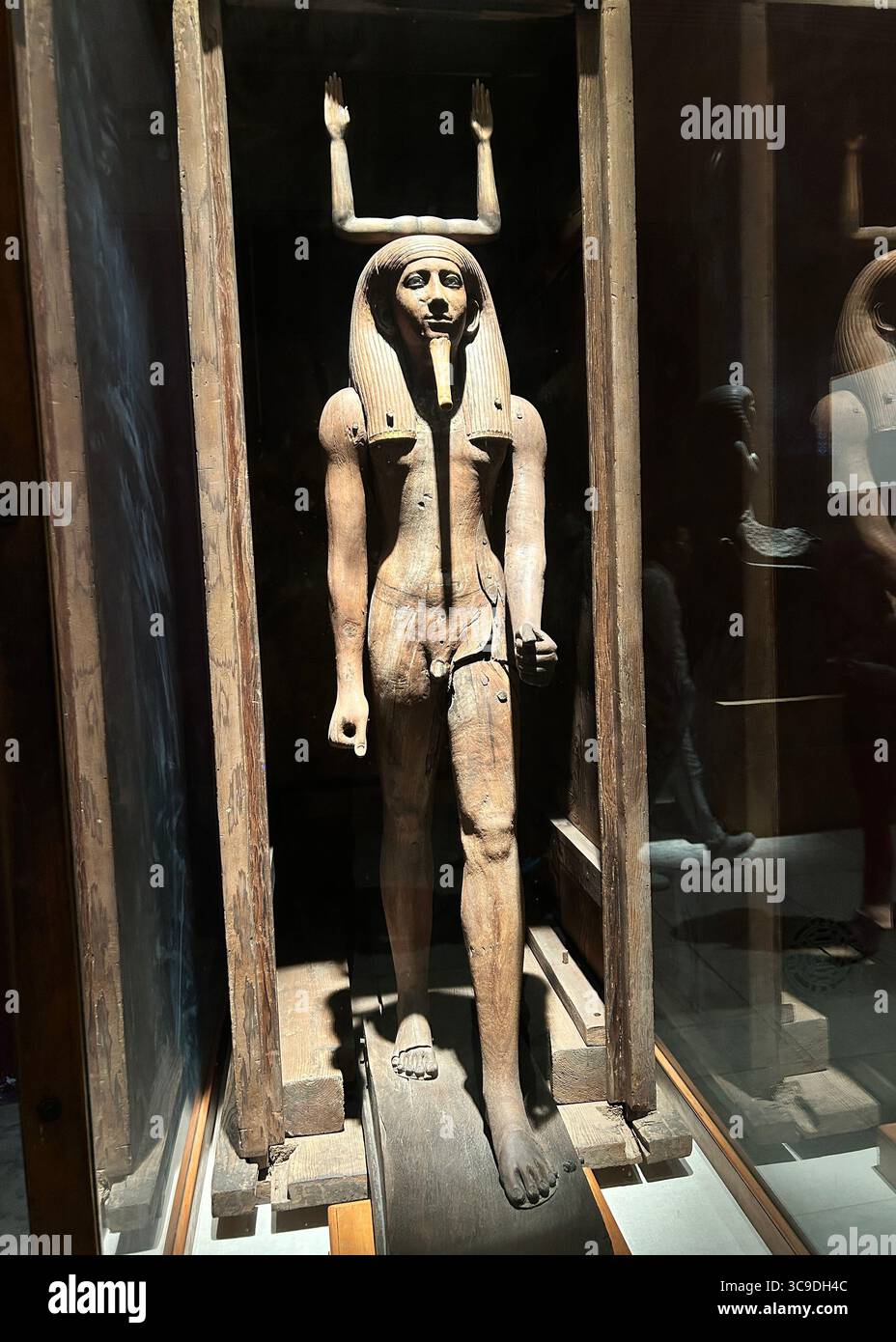 Wooden Ka statue of King Hor with raised arms and Ka sign above head ...
