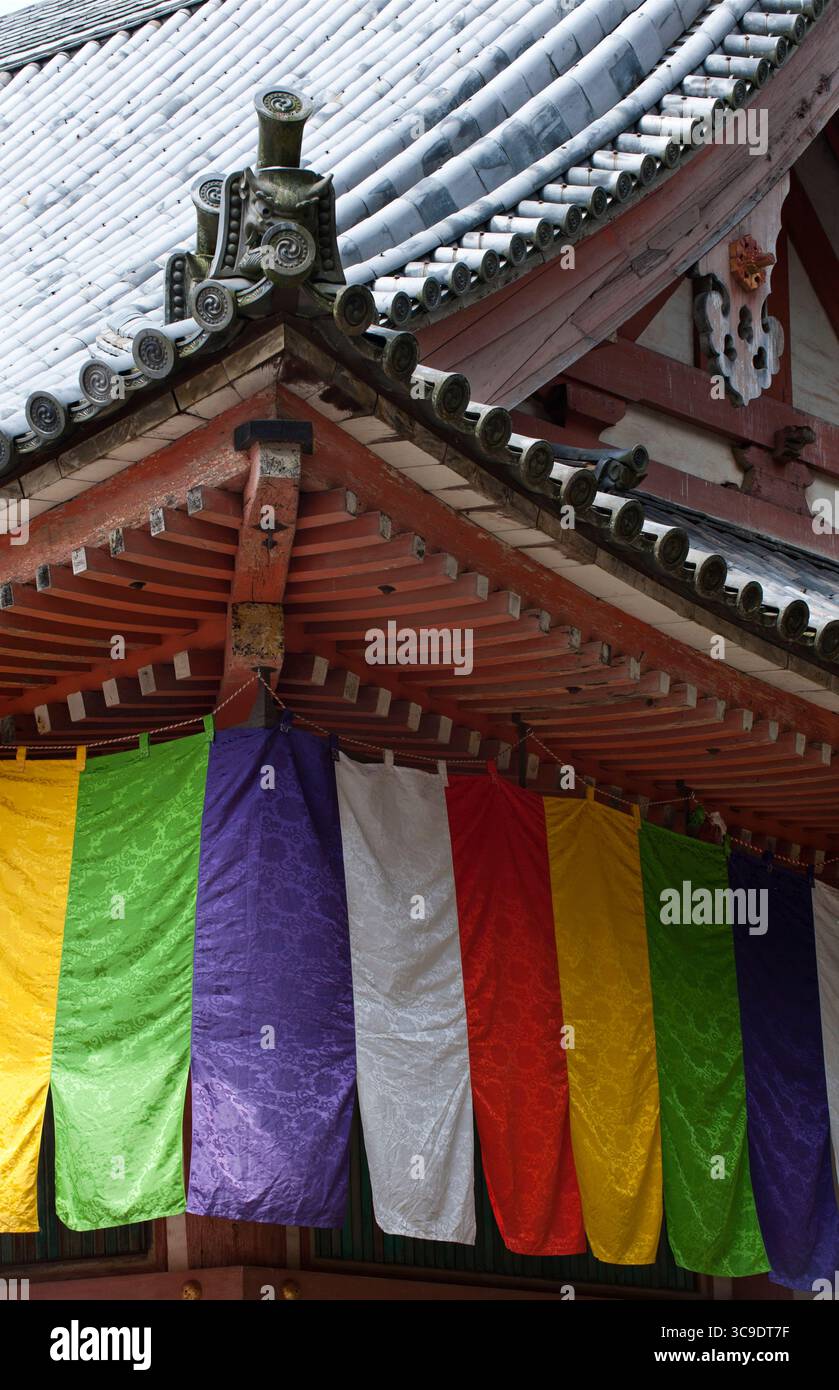 Rainbow banners hanging from the eaves of the Kondo (金堂, Golden Hall ...