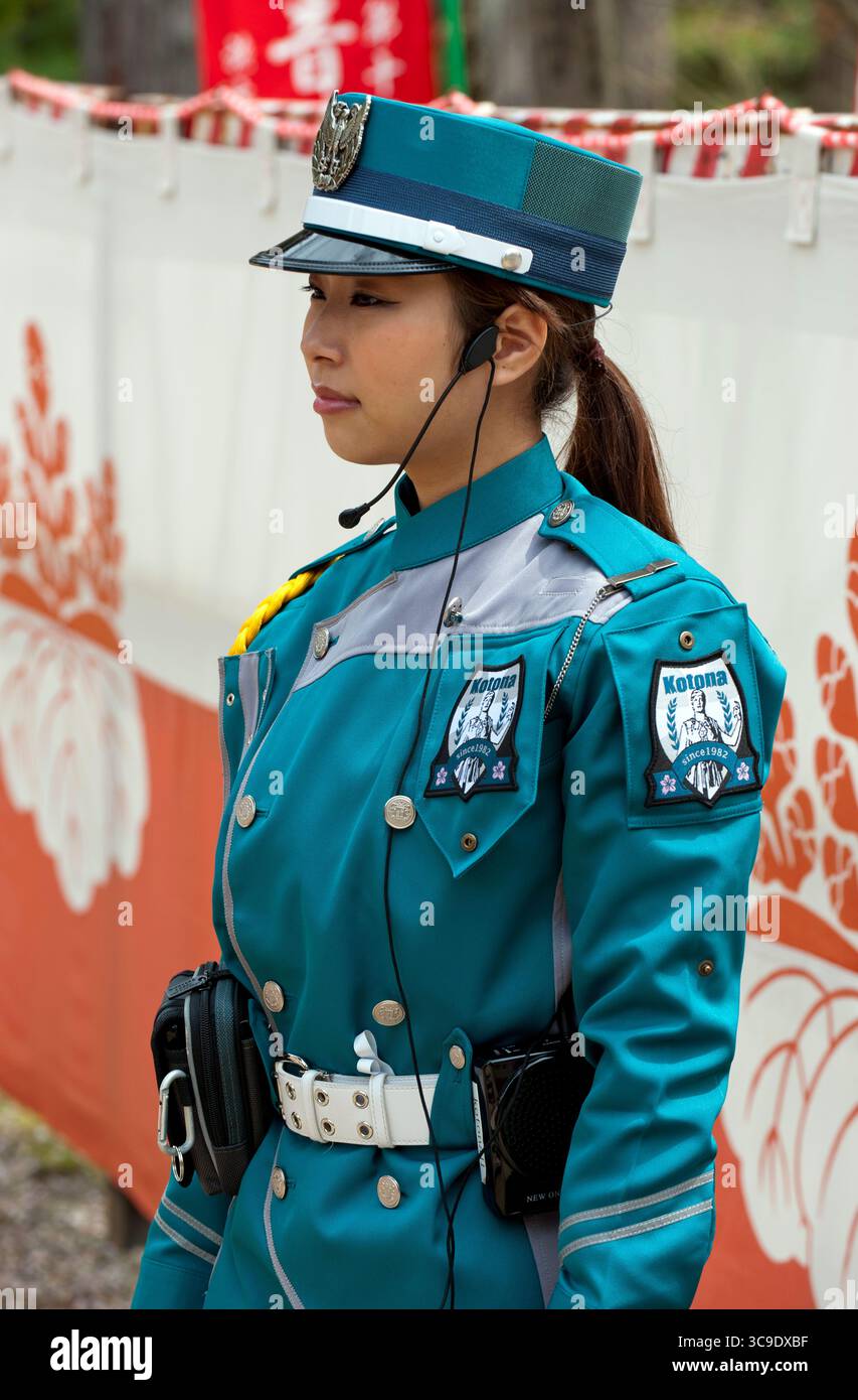 Young Japanese female security guard looking very authoritative and ...
