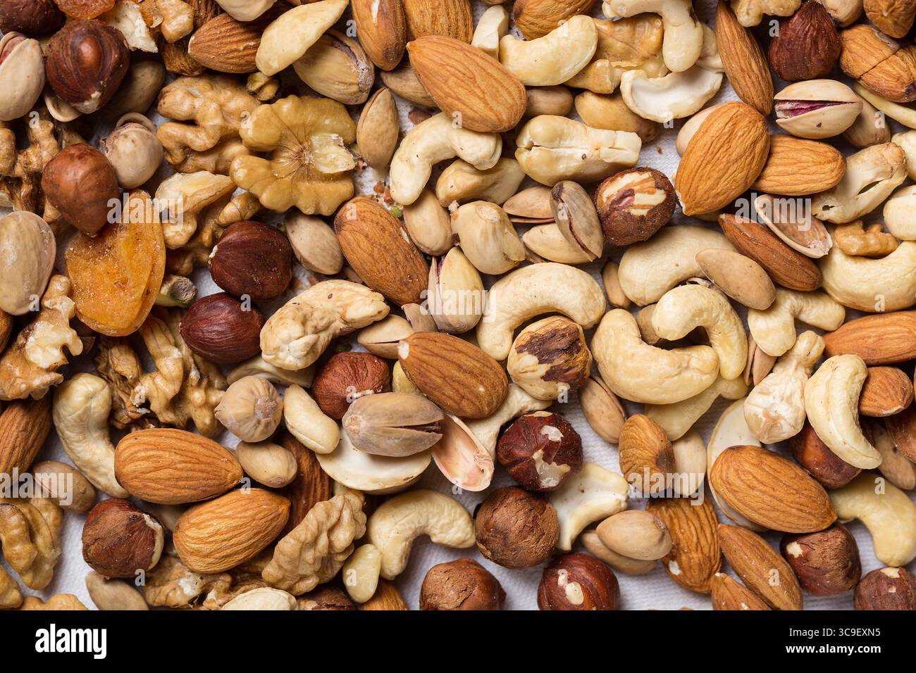 Background from various kinds of nuts almond walnut hazelnut cashew ...