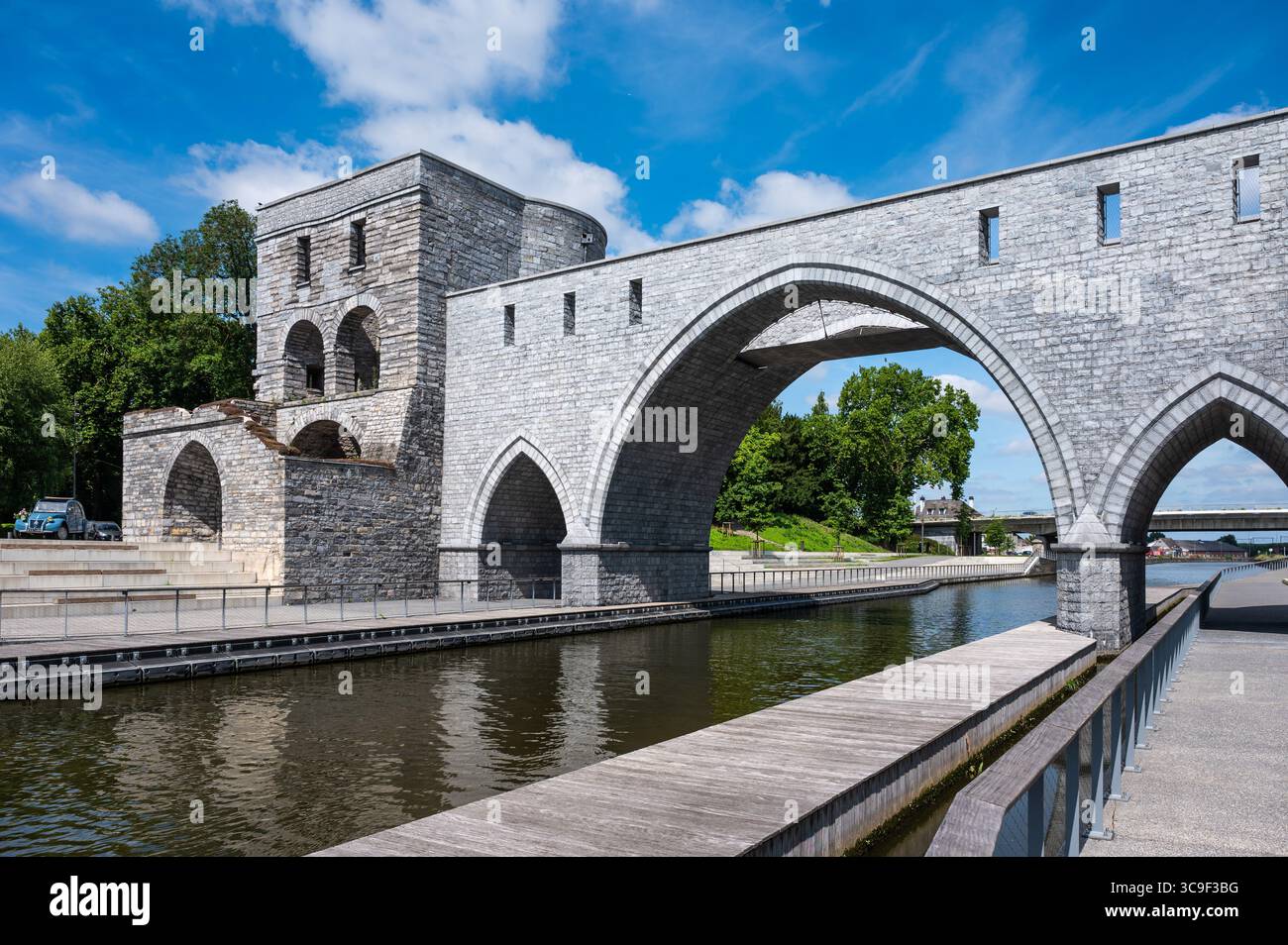 Medieval gate and bridge Pont des Trous over the river Scheldt in ...
