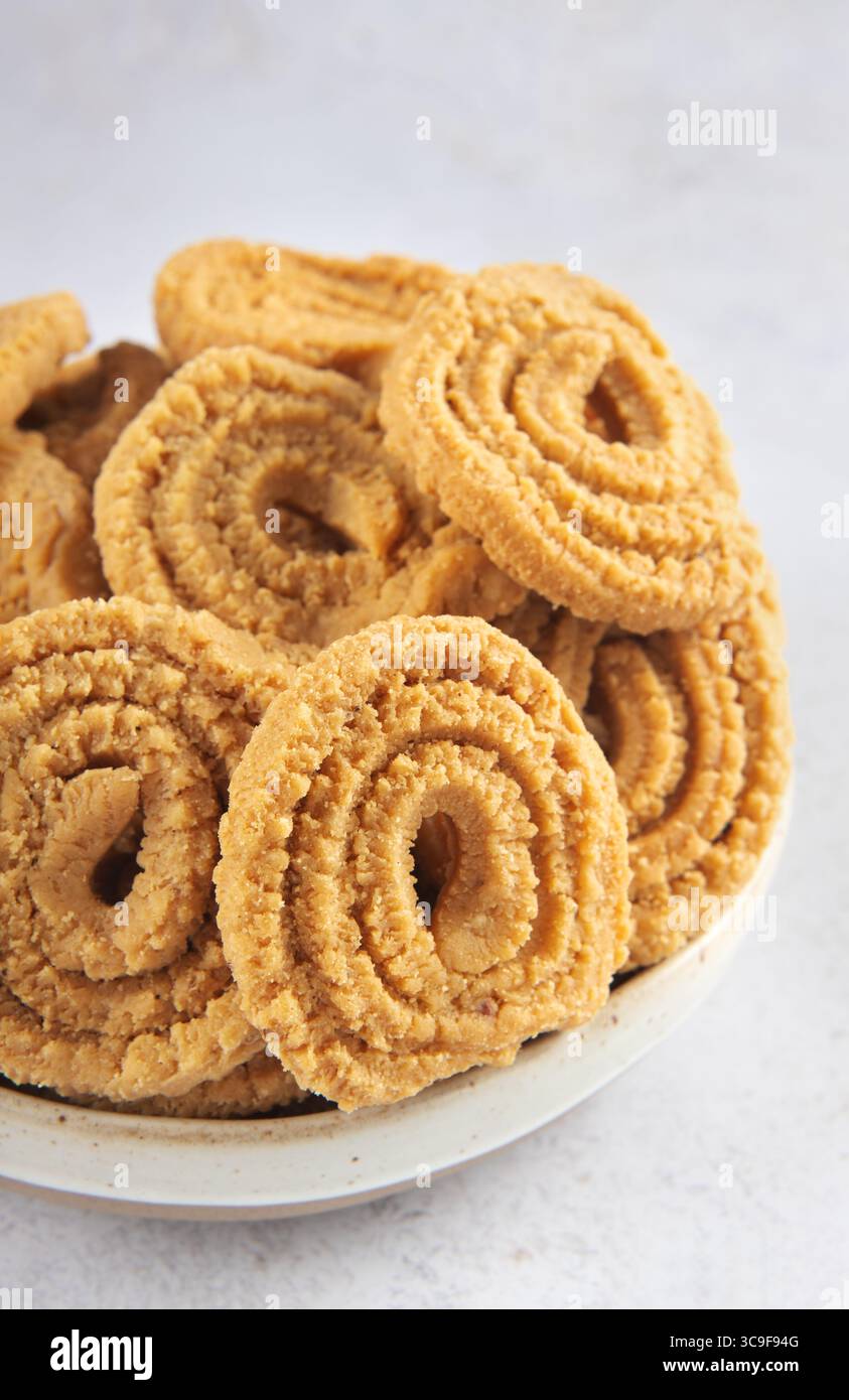 Indian chakli (murukku) snacks on white background. Traditional crispy ...