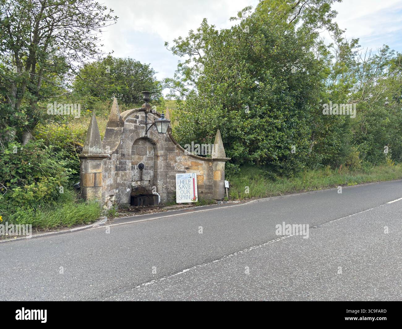 Historic Lion’s Head Fountain in Carlops, a carved stone water feature ...
