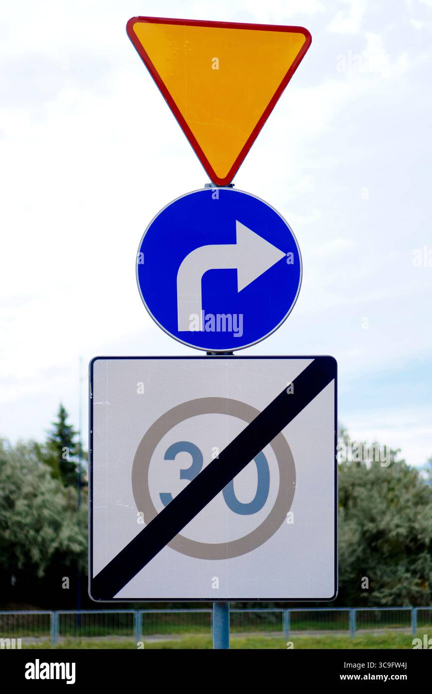 Turn right blue sign combined with other signs on a single post Stock ...