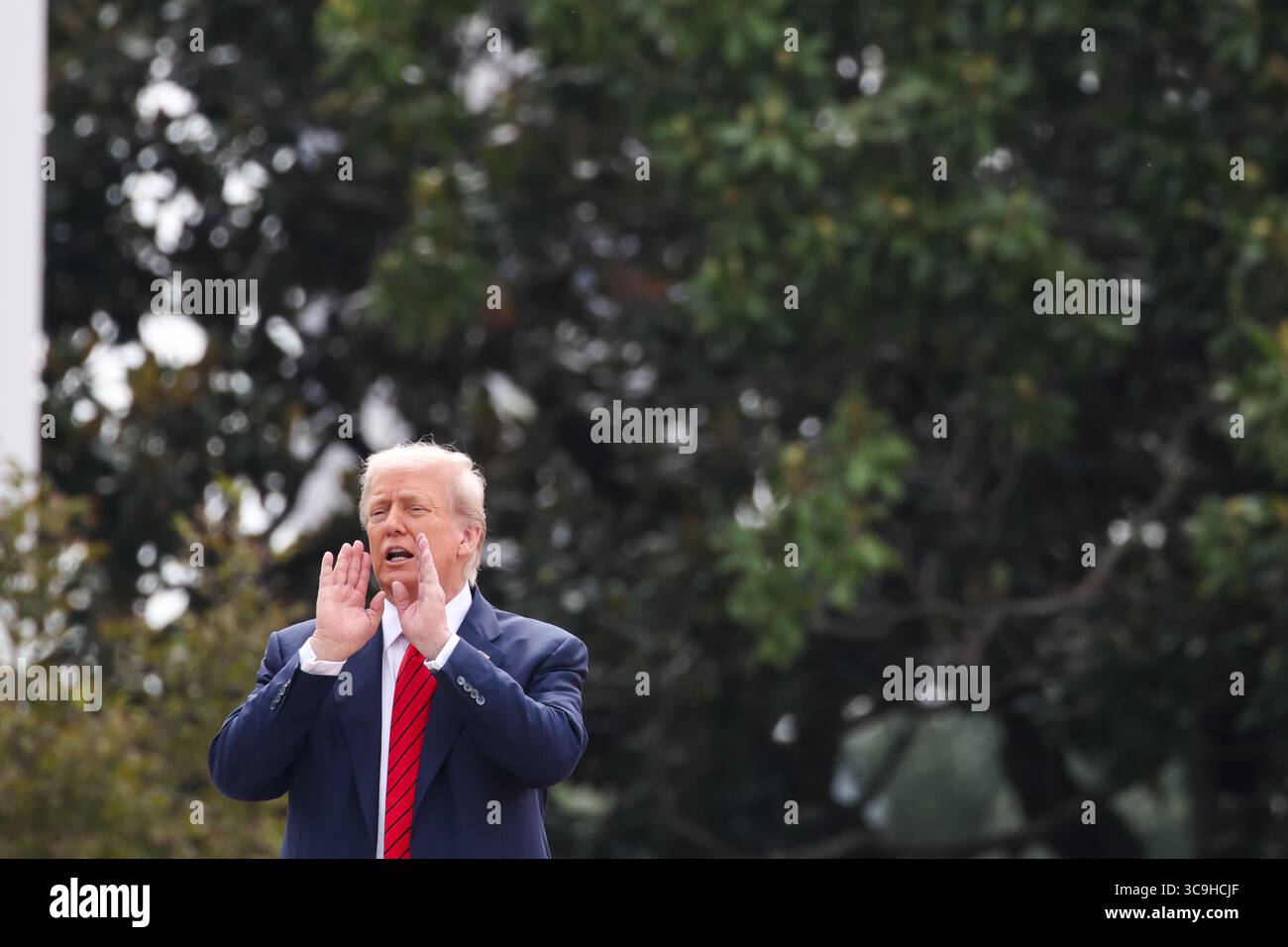 United States President Donald J Trump gestures to the media from the ...