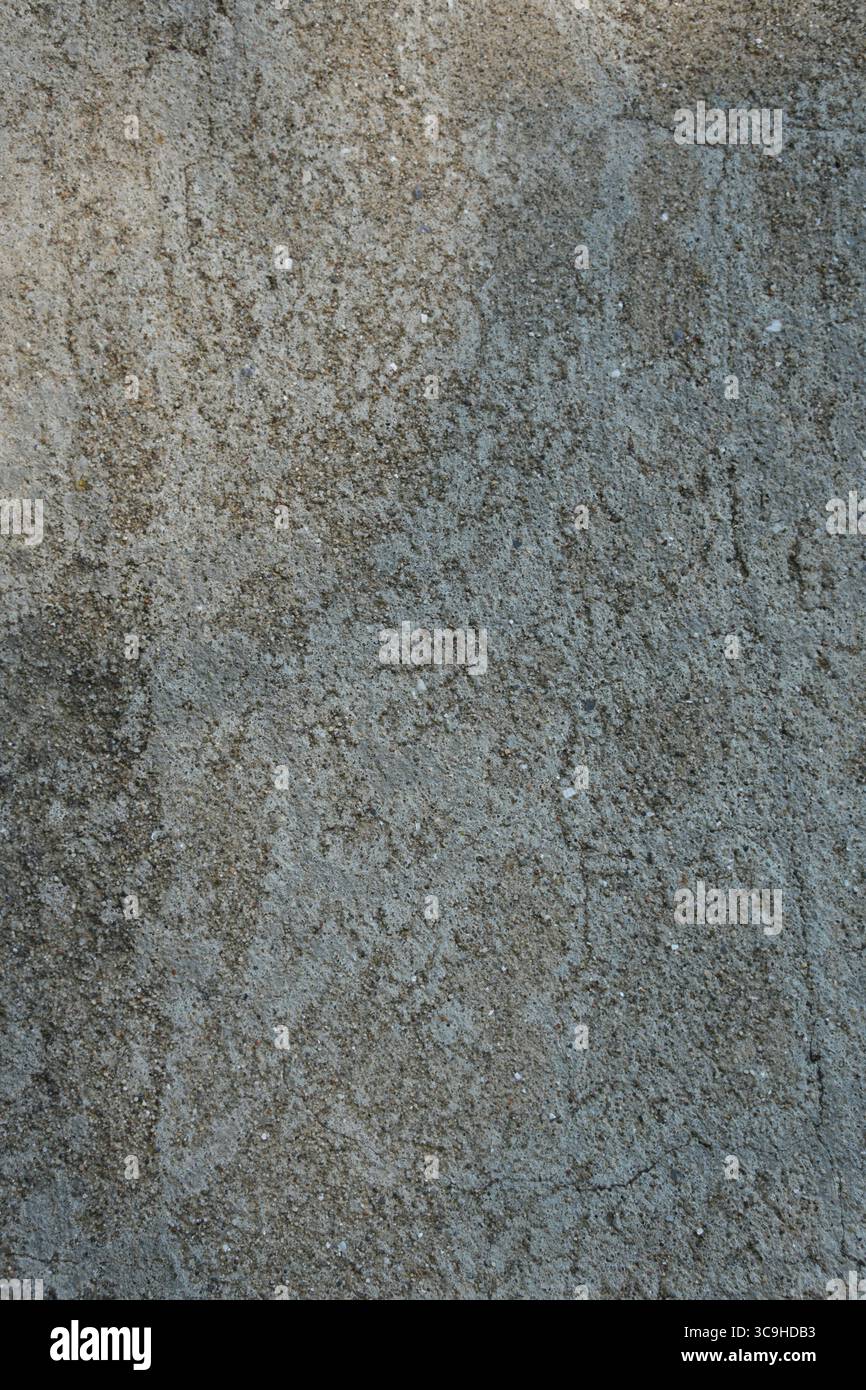 Macro image of a rough-textured concrete wall showing natural ...