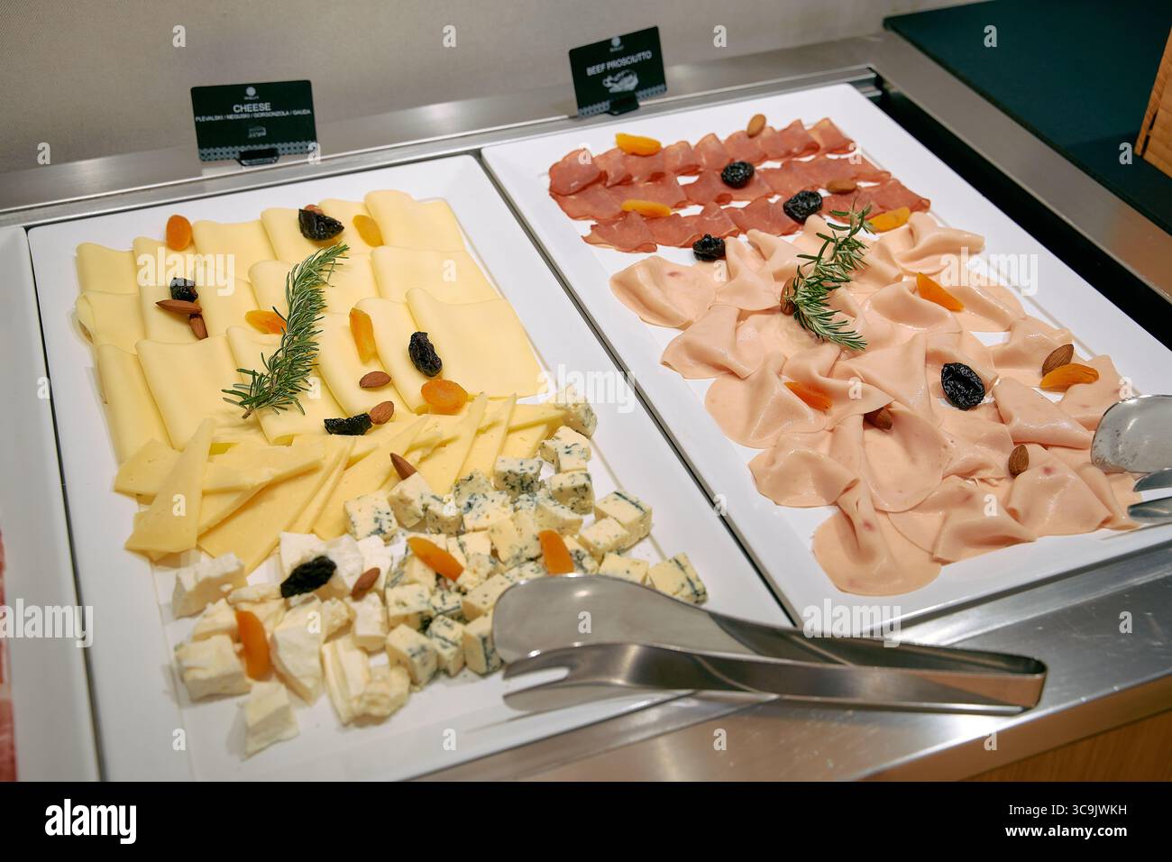 A Vast Array of Cheeses and Cured Meats Displayed Elegantly on Platters ...