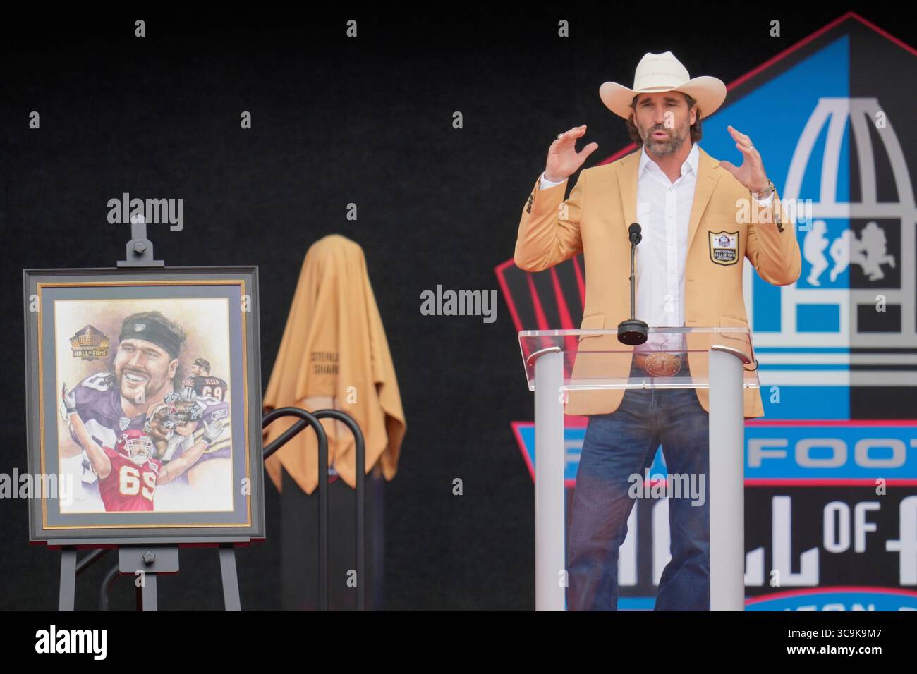 Former NFL player Jared Allen, speaks next to his portrait during his ...