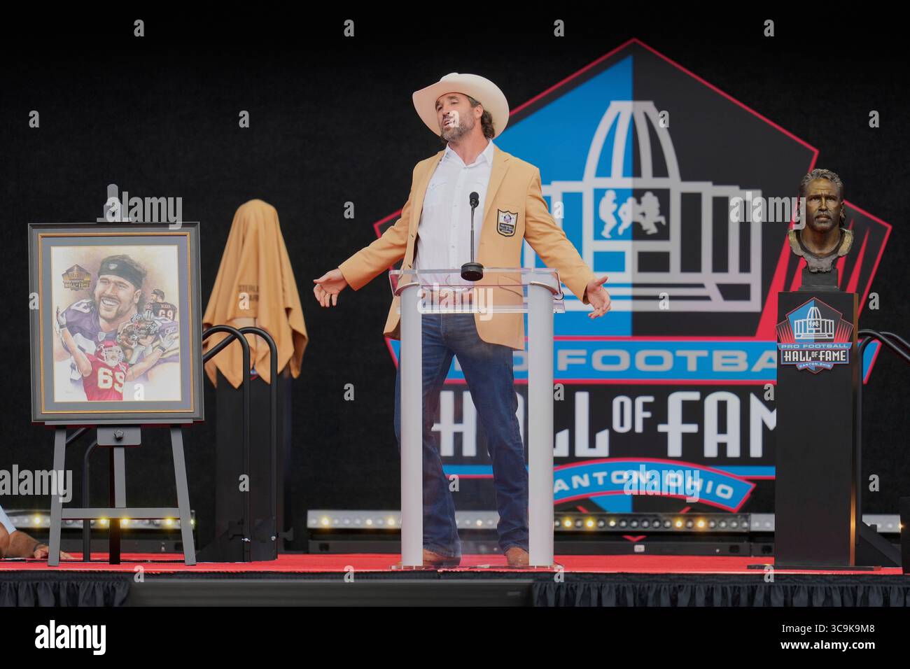 Former NFL player Jared Allen, speaks between his portrait and his bust ...