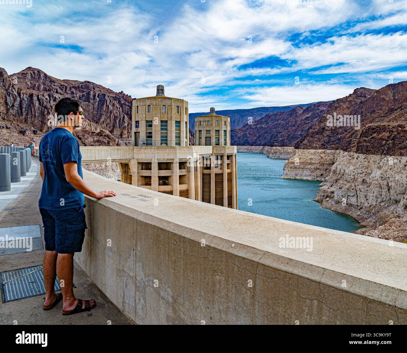 A thoughtful tourist admires the view from the Hoover Dam, a National ...