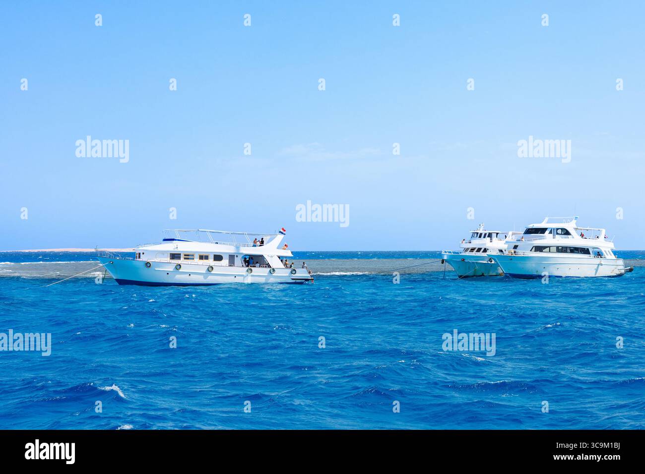 Three boats sailing on horizon hi-res stock photography and images - Alamy