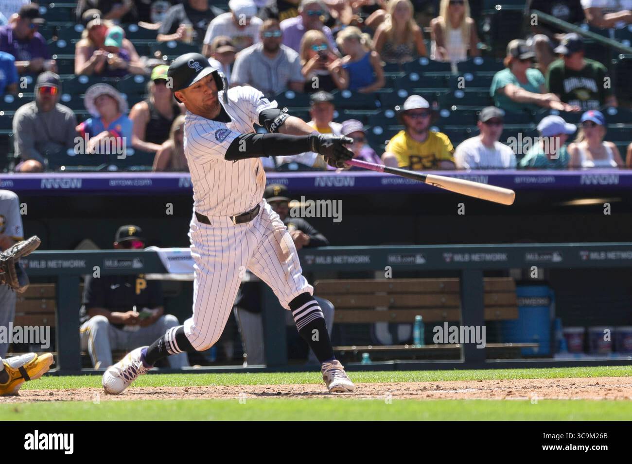 Colorado Rockies catcher Hunter Goodman (15) swings at the ball in an ...
