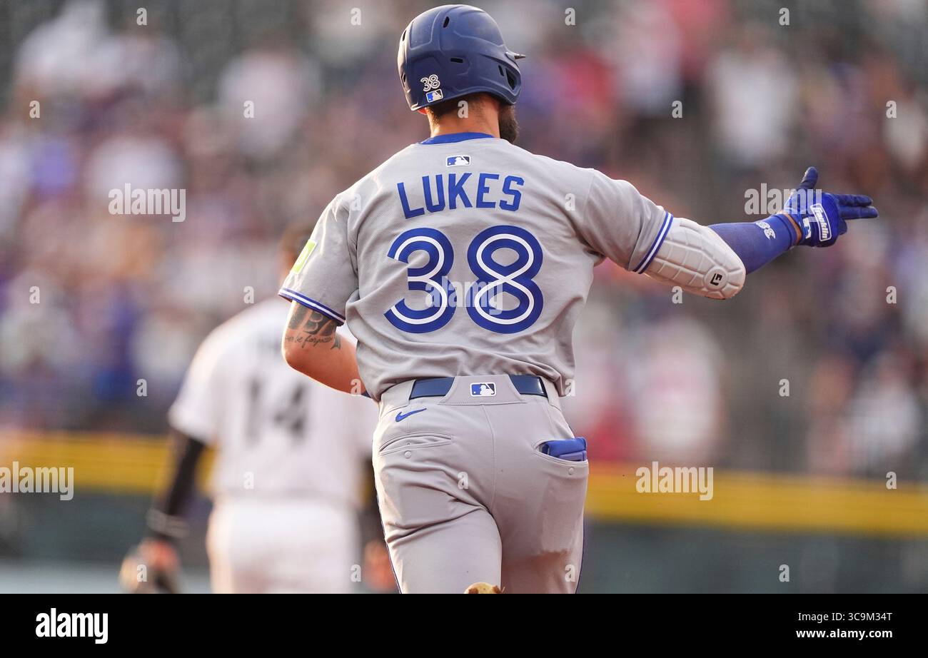 Toronto Blue Jays' Nathan Lukes gestures to the bullpen as he rounds ...