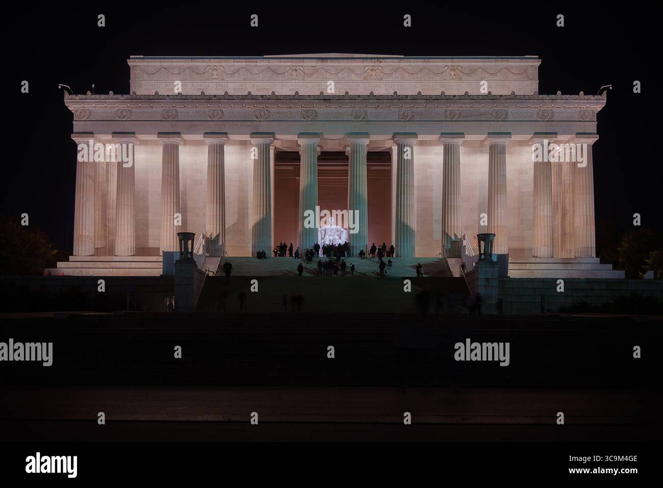 Visitors show reverence at the Lincoln Memorial, completed in 1922. The ...