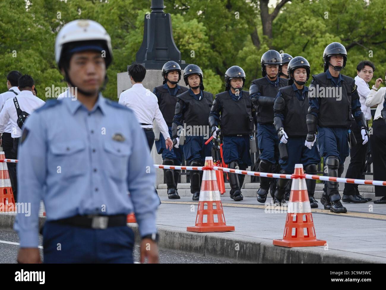 Police officers stand guard in front of Peace Memorial Park in ...