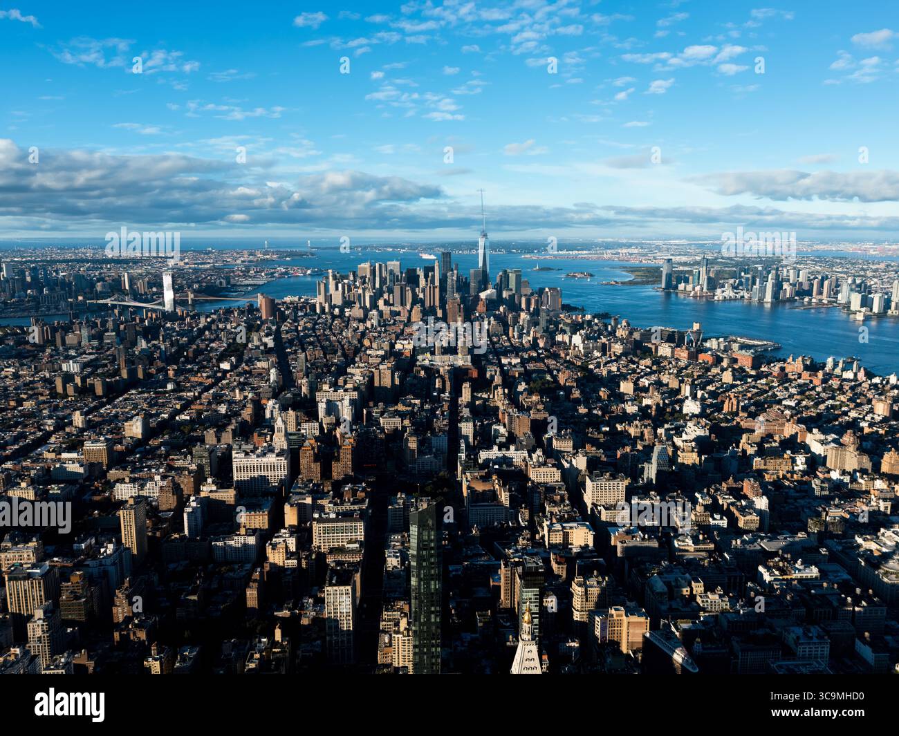 An aerial photo of Manhattan's downtown from above during the sunrise ...