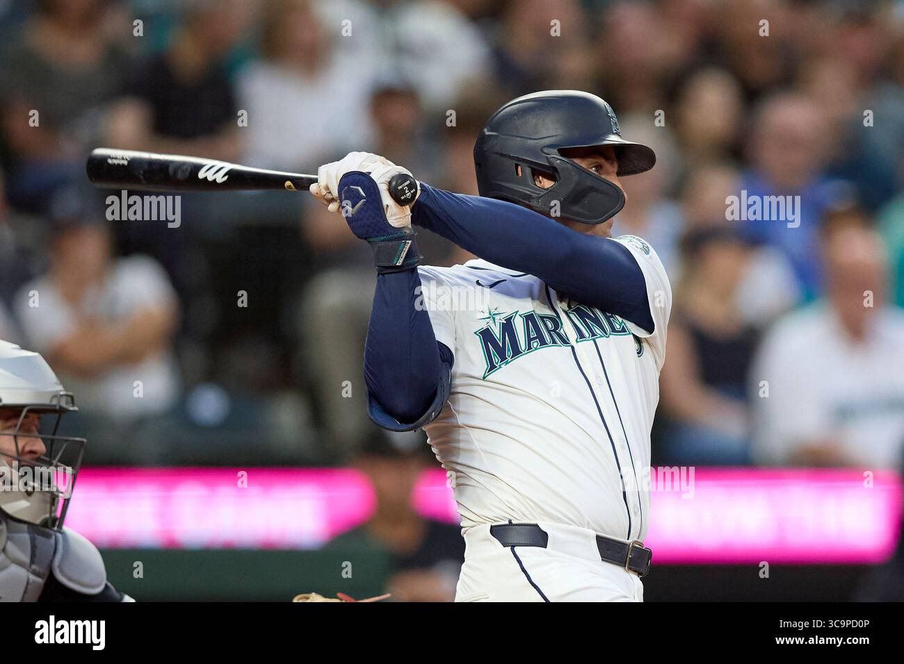 Seattle Mariners' Cole Young singles against the Chicago White Sox ...