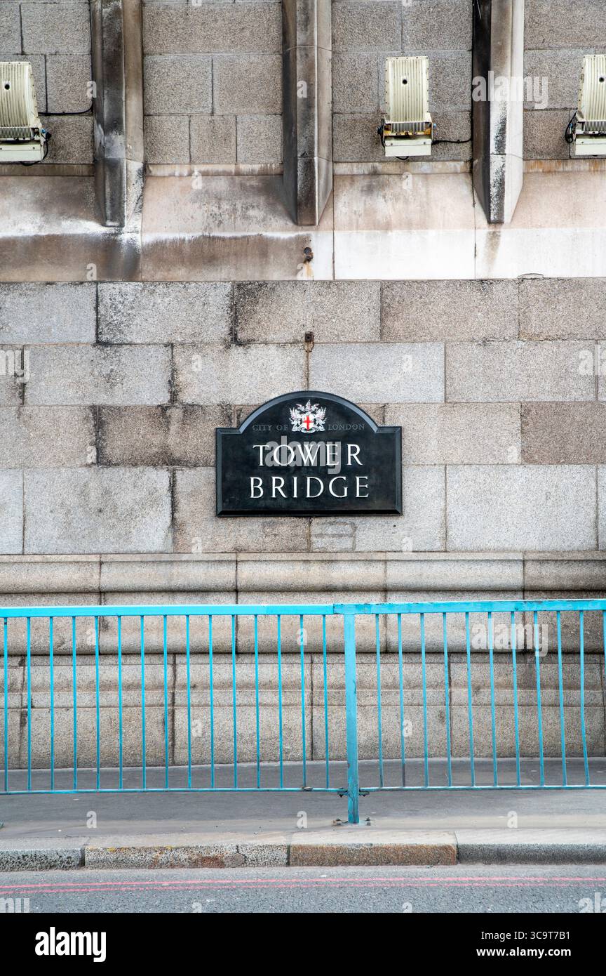 Tower Bridge sign on the wall. The Tower Bridge is a suspension bridge ...