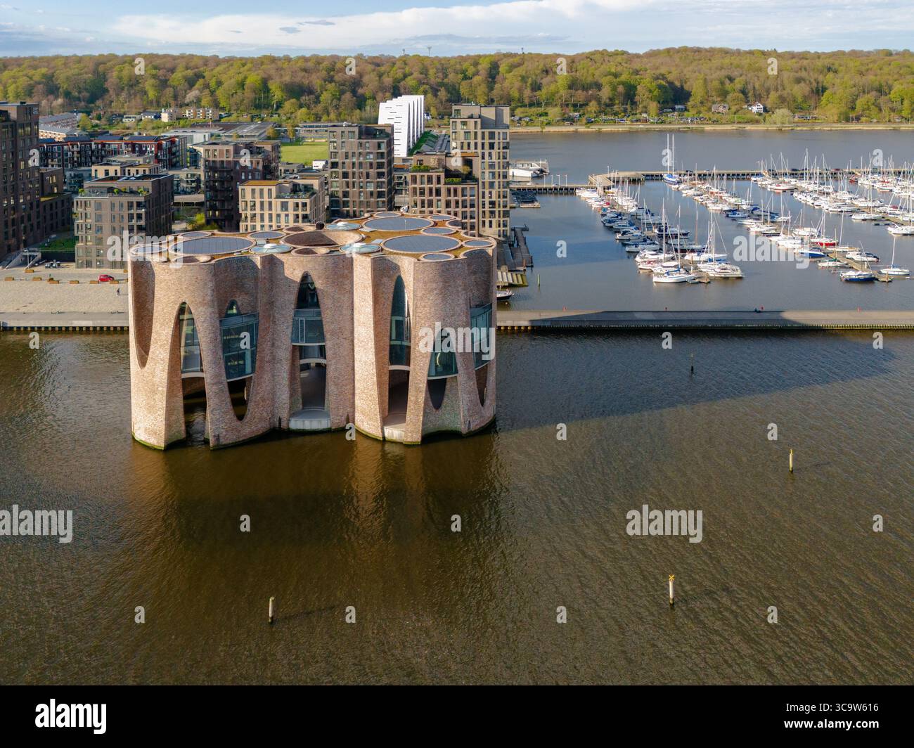 Aerial view of the iconic Fjordenhus, its brick facade reflecting in ...