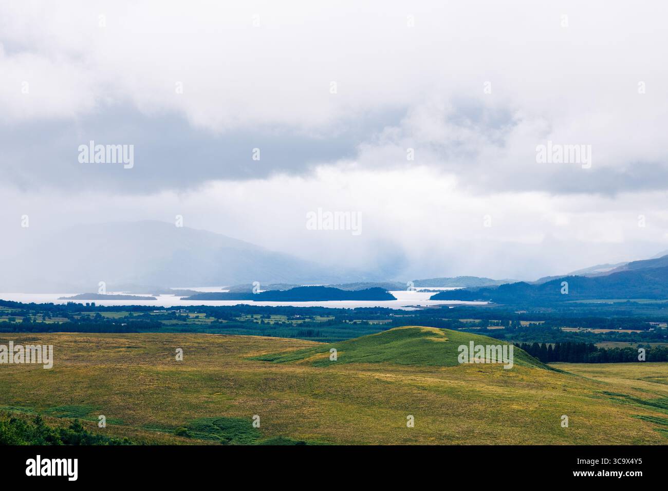 Expansive Scottish Highlands landscape with rolling hills, moody skies ...