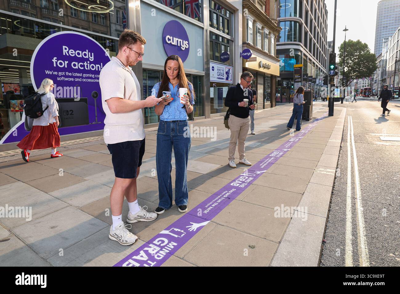EDITORIAL USE ONLY A purple line is installed outside Currys on Oxford ...