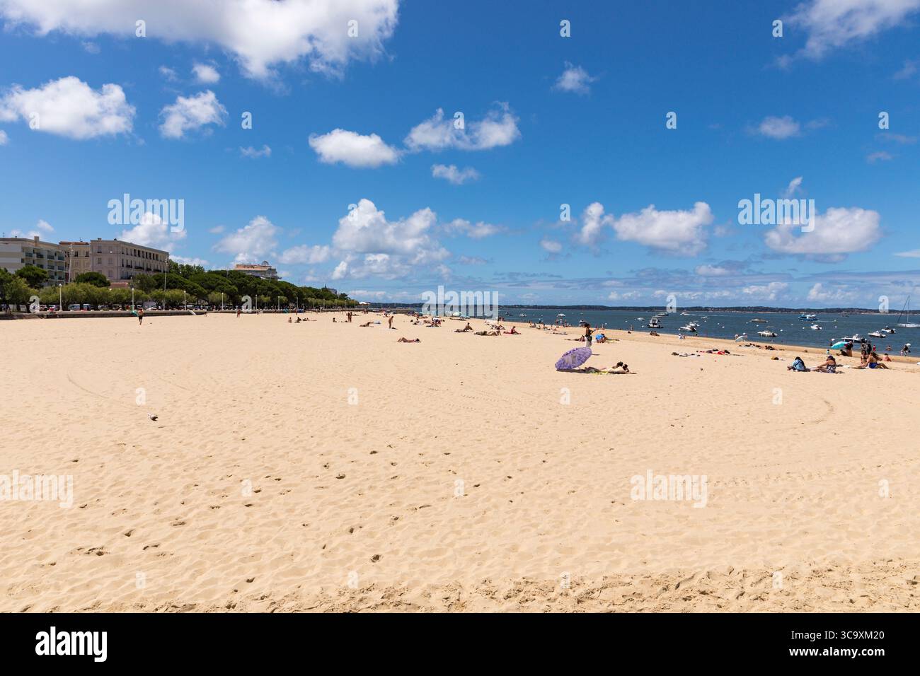 Arcachon, France – June 26, 2025: People sunbathing at the beach south ...