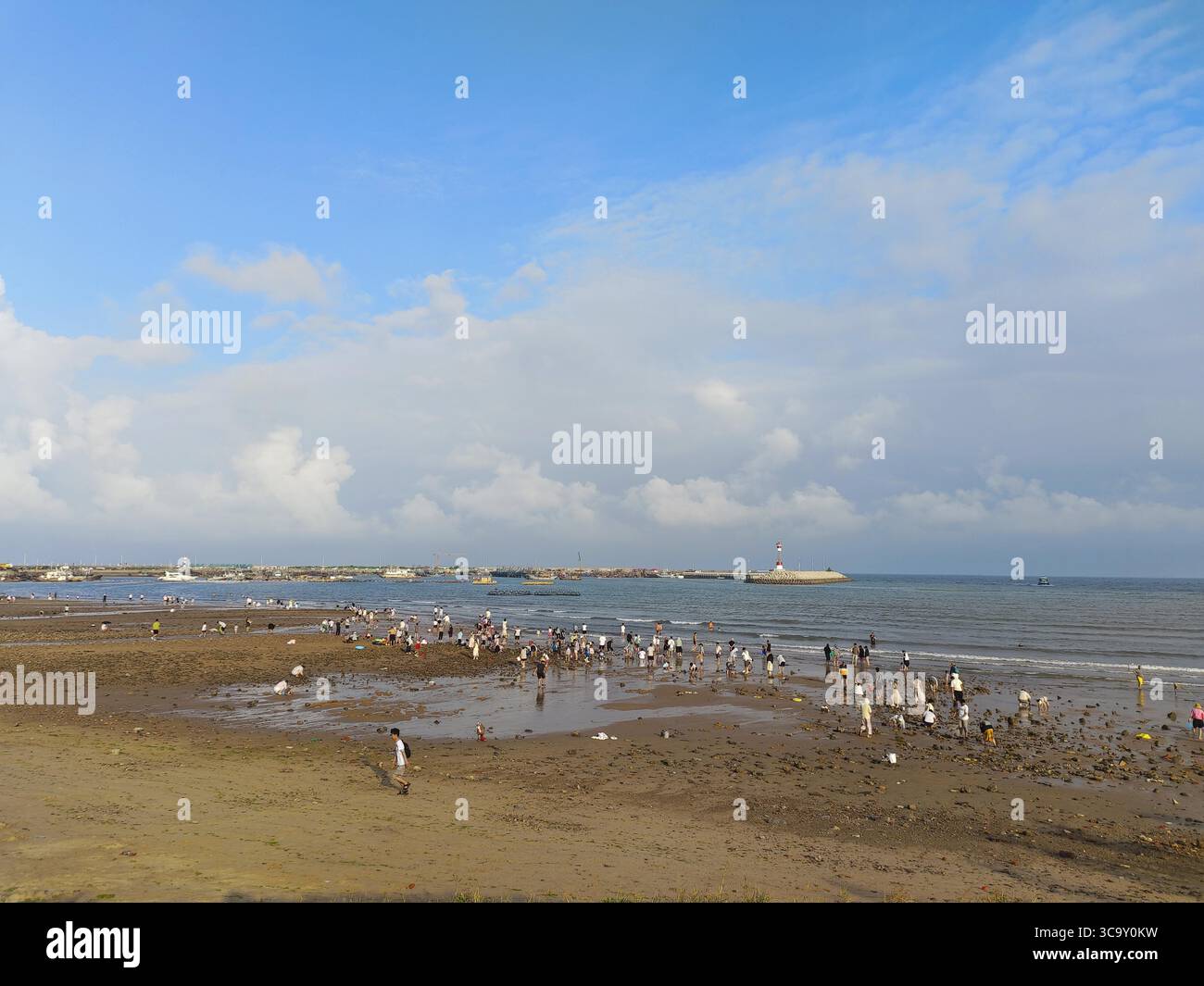 Tourists go beachcombing in Rizhao City, east China's Shandong Province ...